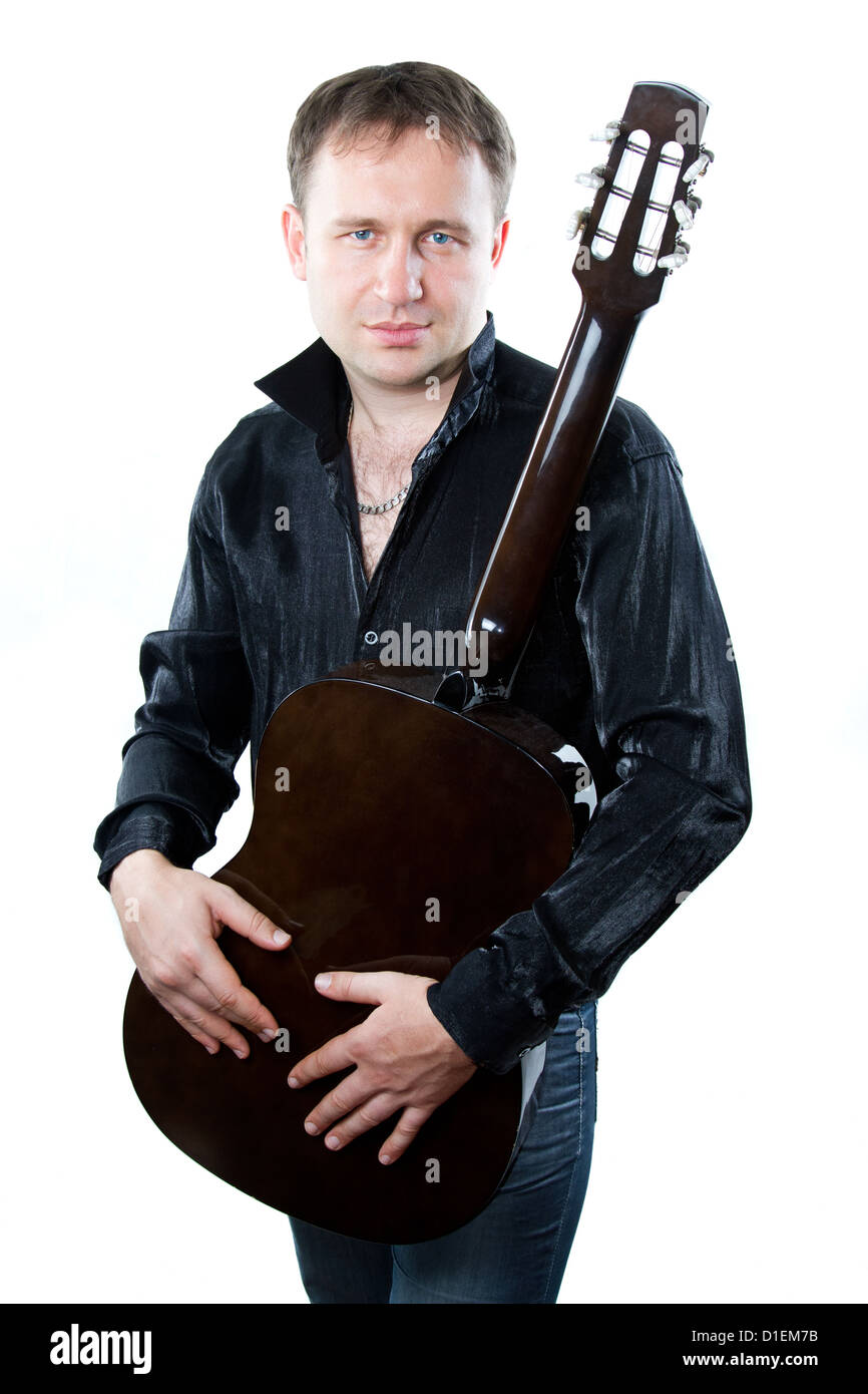 Musical instrument. Guitarist playing acoustic six-string guitar ...