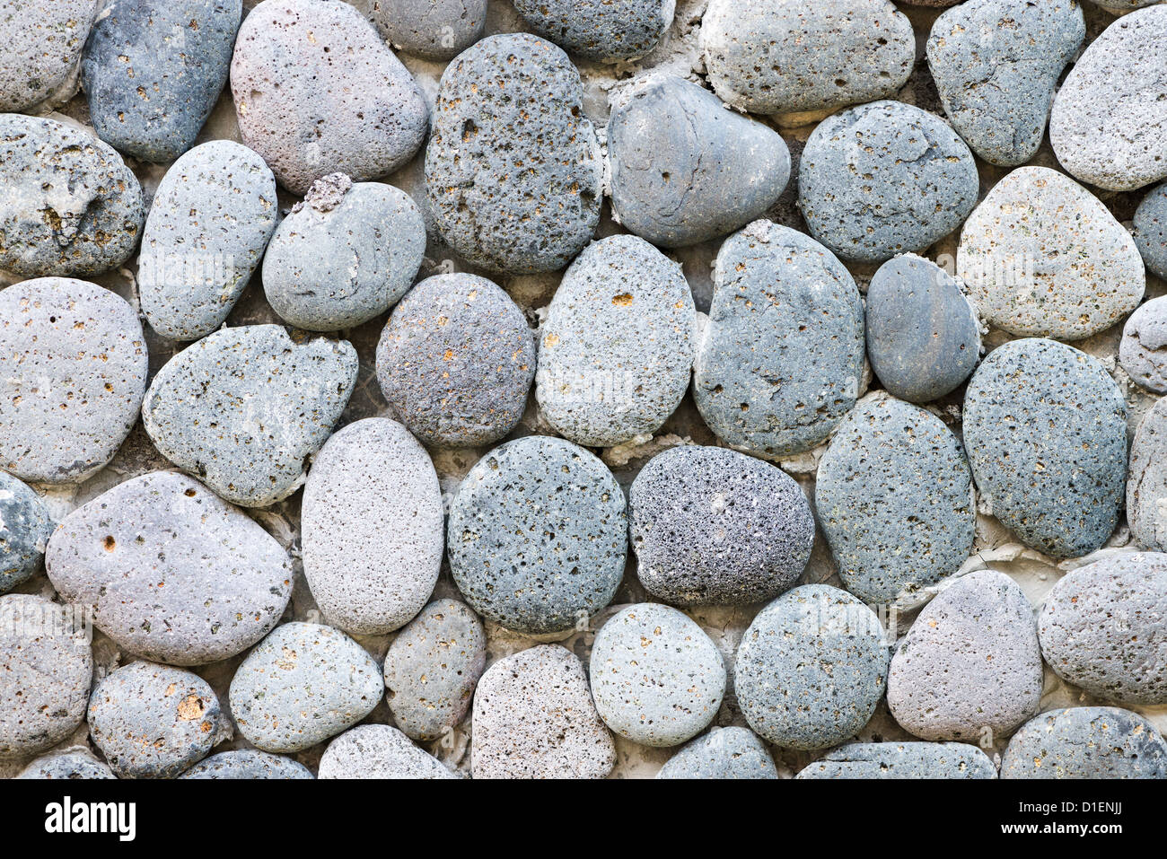 Grey peddle stone wall background Stock Photo - Alamy