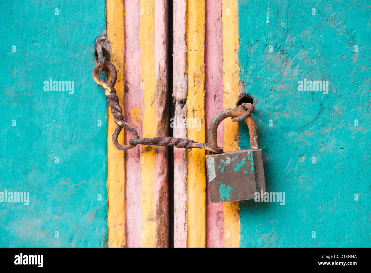 Vintage lock and chain on an old colorful wooden door Stock Photo - Alamy