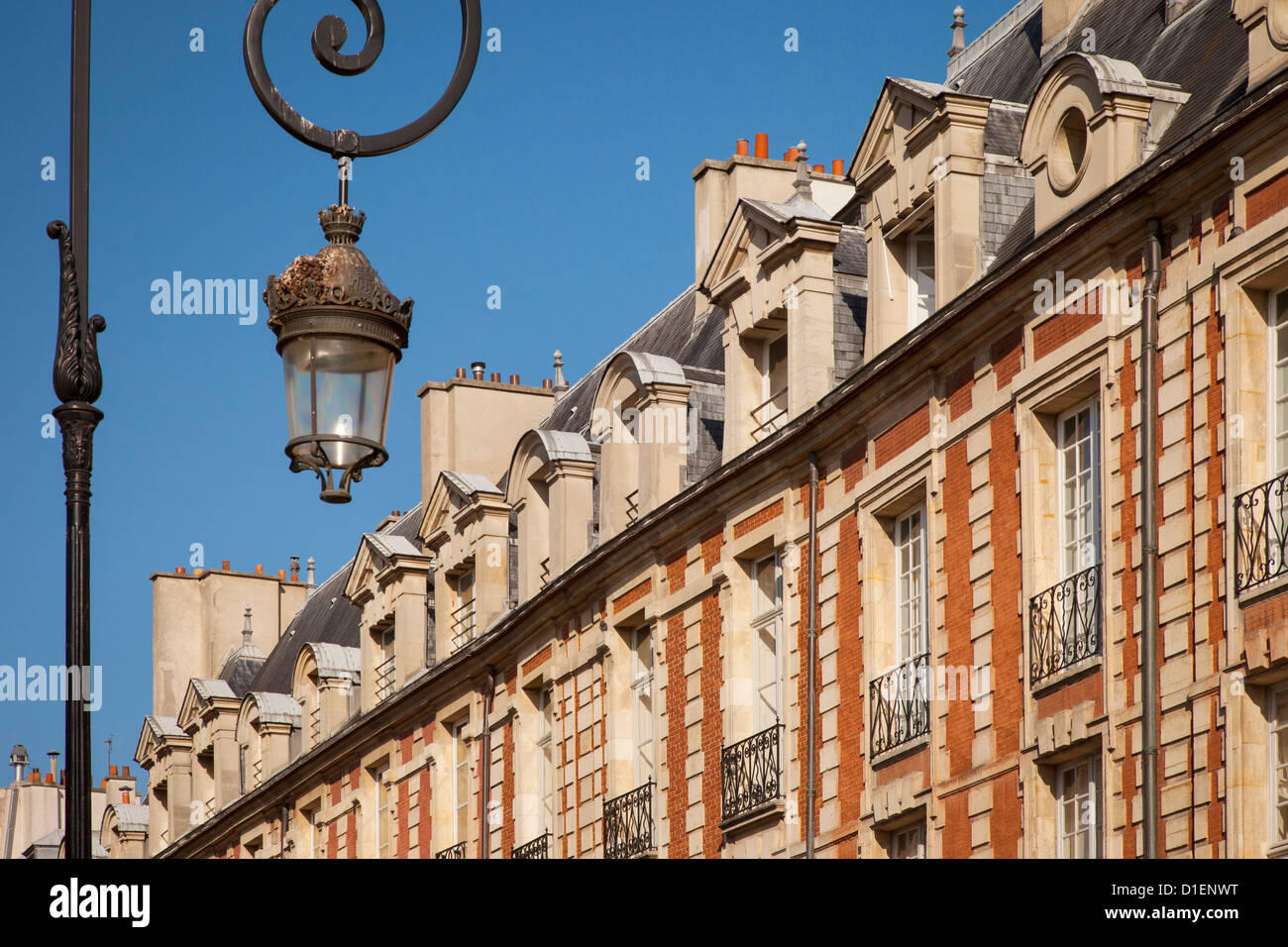 Lamp and achitecture in Place des Vosges - the oldest public square in ...