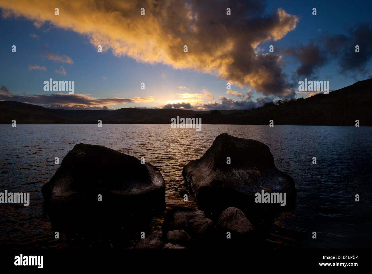 December Sunset with weird strange cloud formations as the sun sets ...