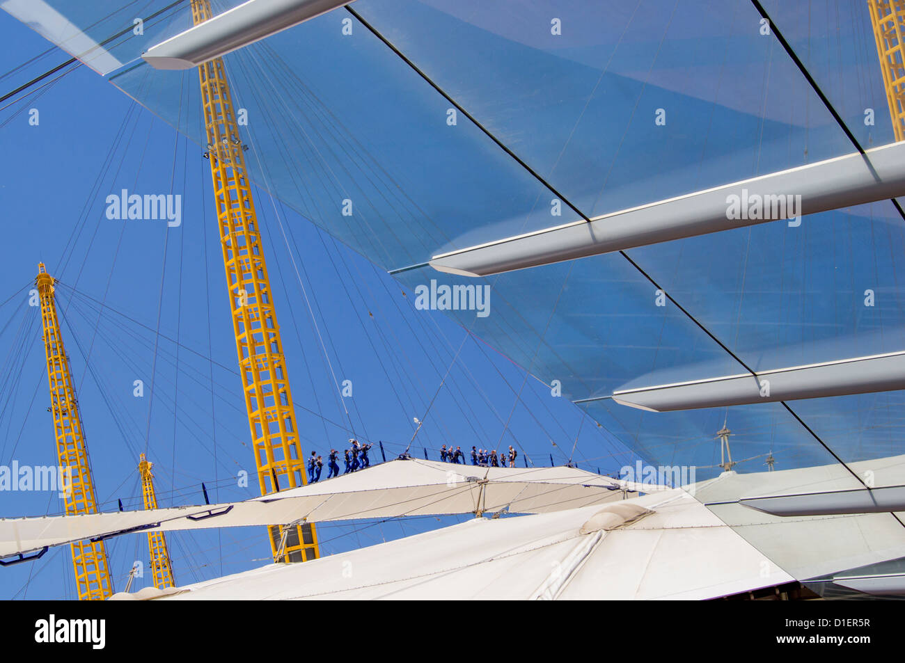 Tourists climbing on roof of Millennium dome, Greenwich, London ...