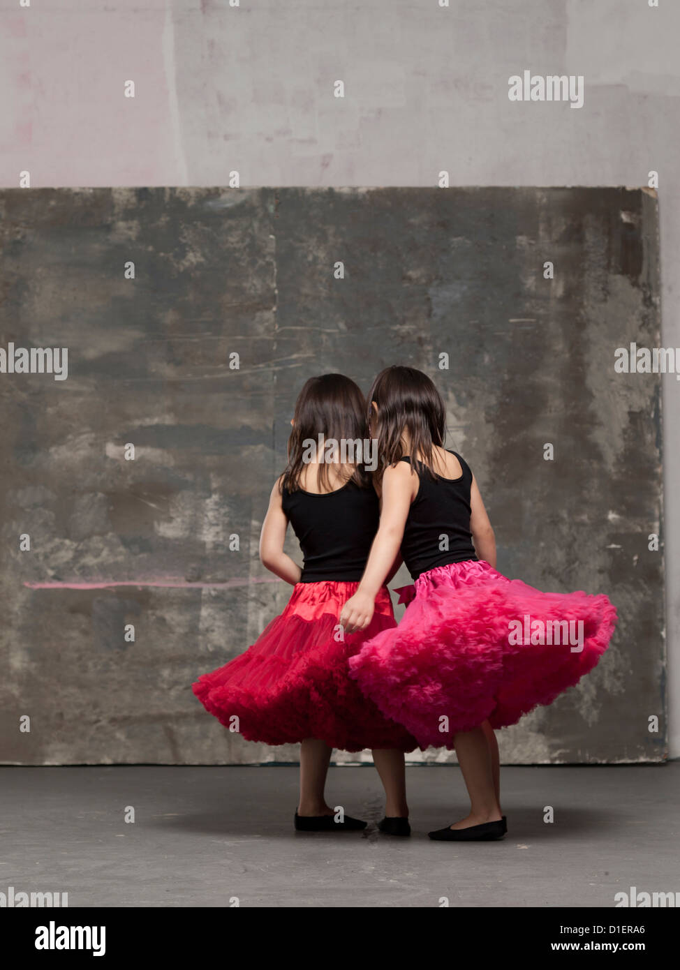Young Asian twins dancing and performing gymnastics Stock Photo - Alamy