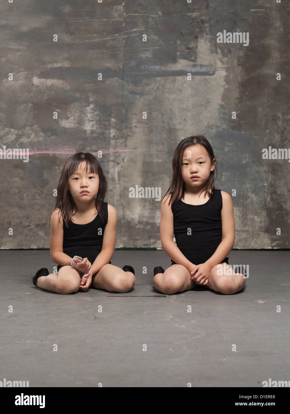 Young Asian twins dancing and performing gymnastics Stock Photo - Alamy
