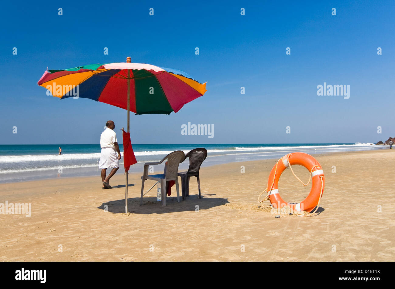 Horizontal portrait of an Indian lifeguard patrolling his area on the ...