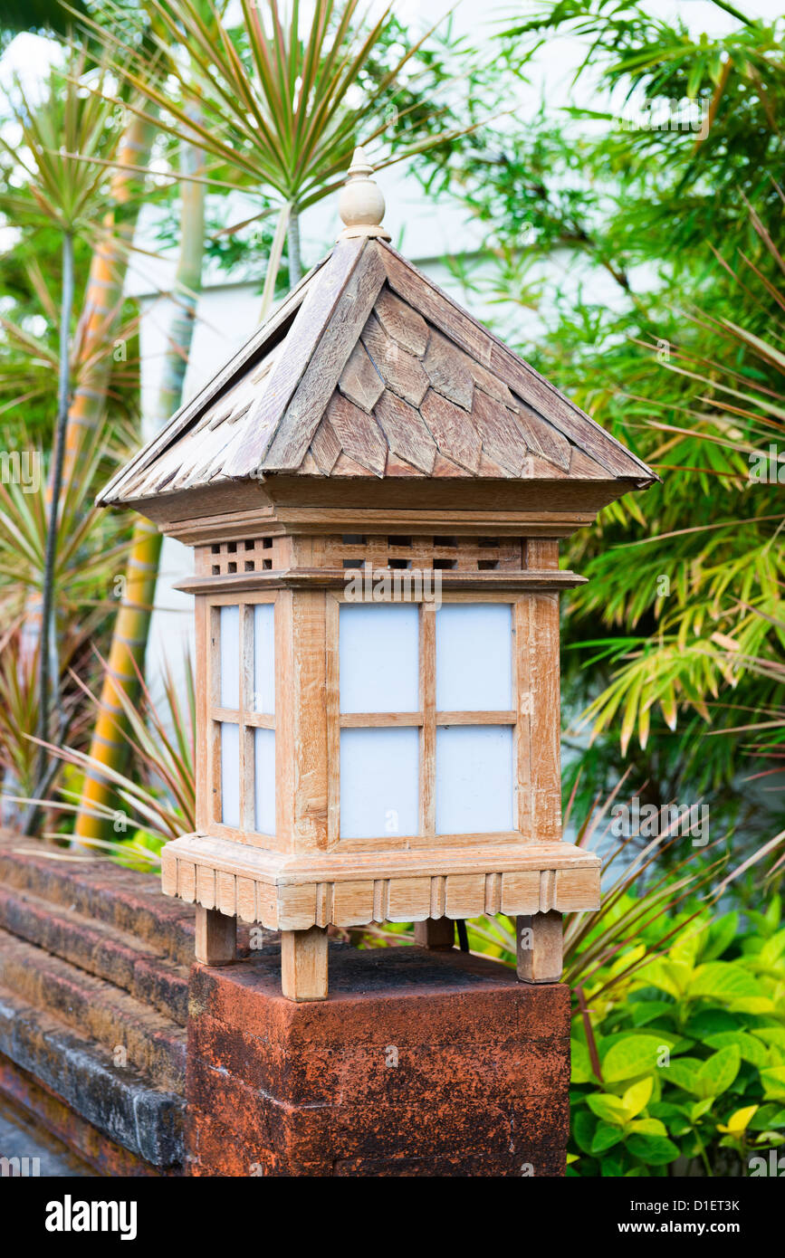 Balinese lanterns in the tropical garden on brick wall Stock Photo - Alamy