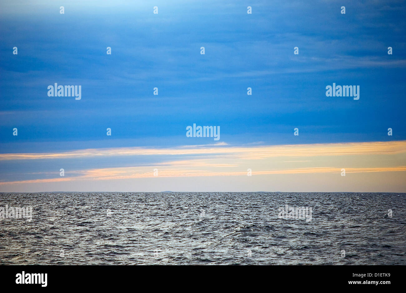 Cold dramatic water with clear blue sky Stock Photo - Alamy