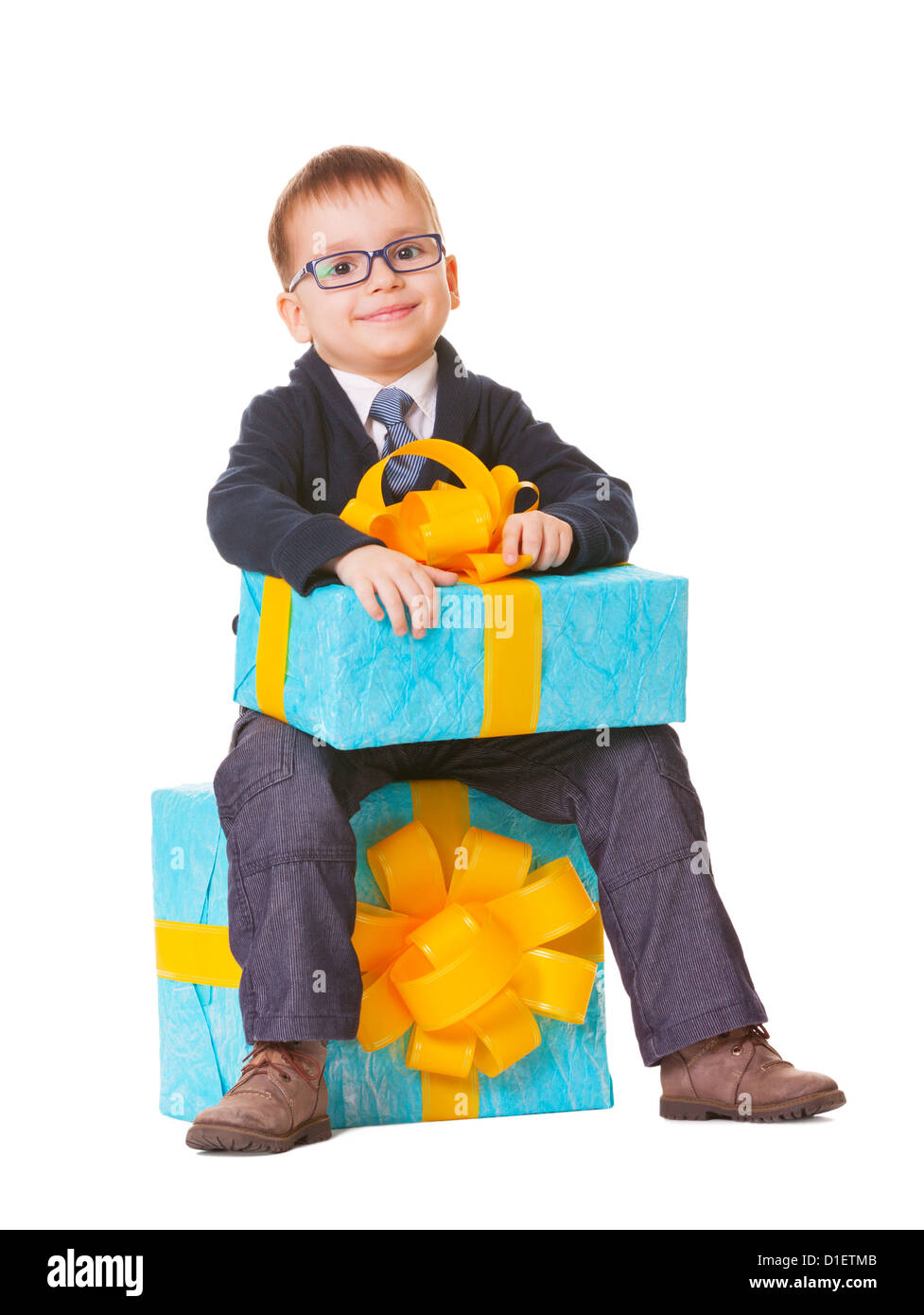Small boy in spectecles with two big presents on white background Stock ...