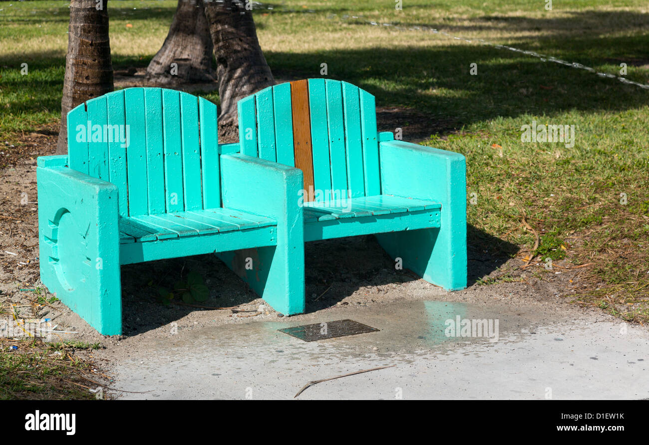 Pair of turquoise wooden street benches or seats in Art deco district ...