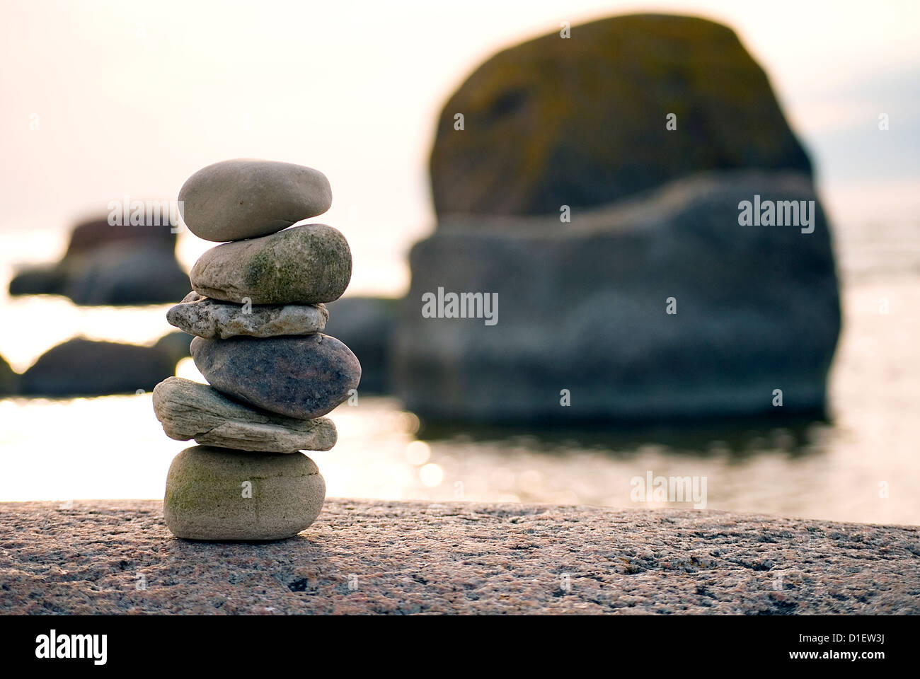 Stack of stones on sea shore, close up Stock Photo - Alamy