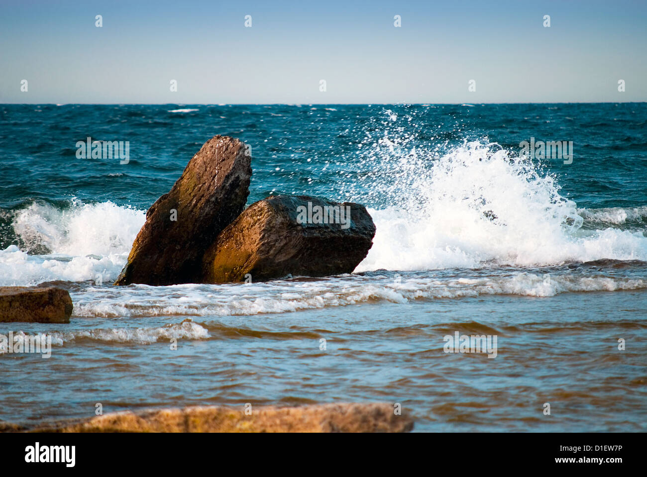 Big wave splash over rocky coast Stock Photo - Alamy