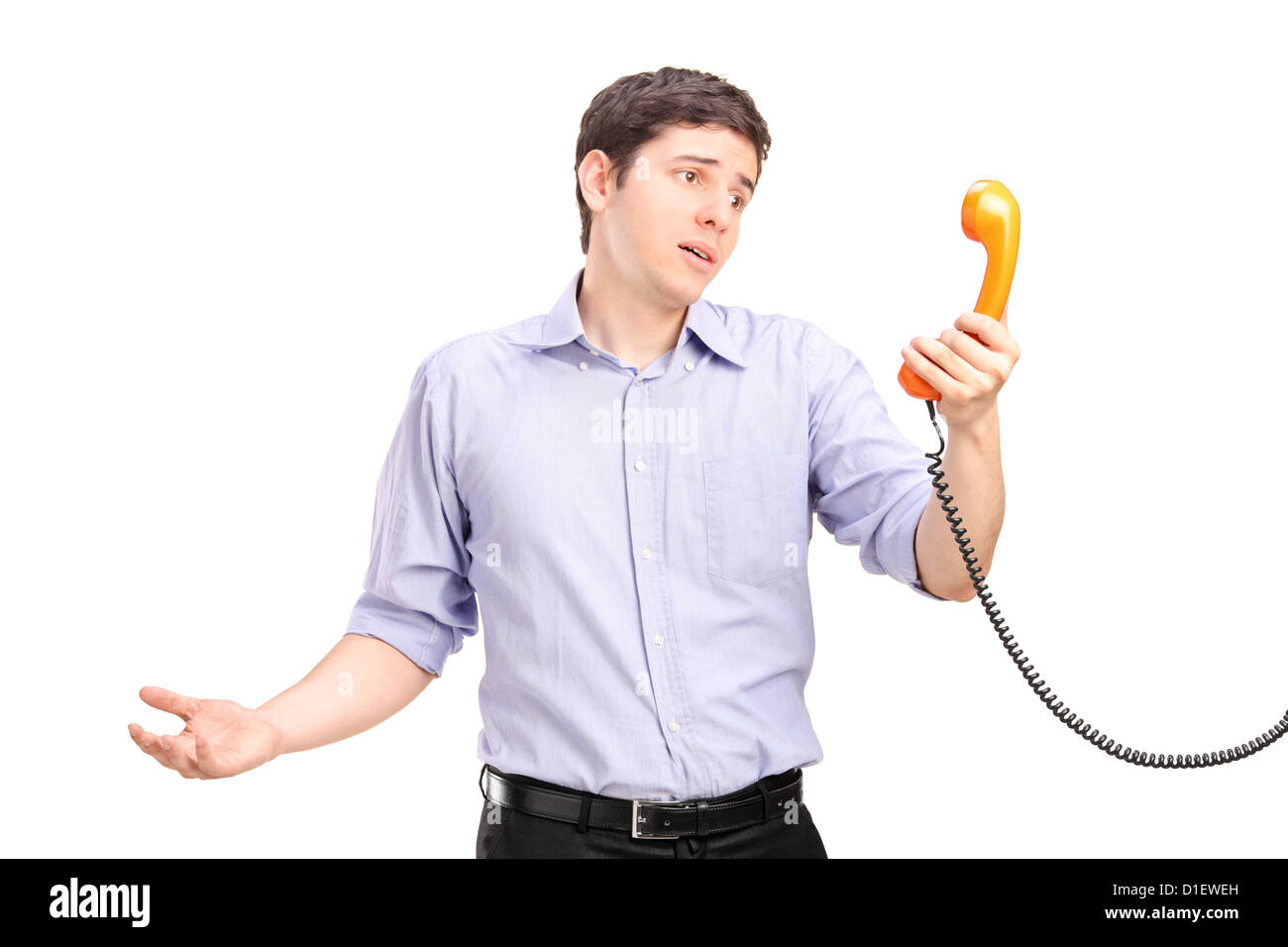 A man holding a telephone and gesturing isolated on white background ...