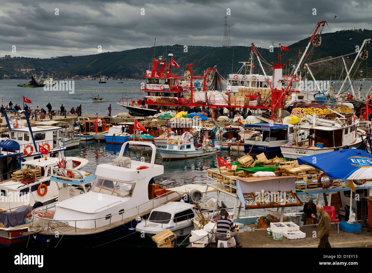 Sariyer Pier with fishing boats on the Bosphorus Strait at Yeni Mahalle ...
