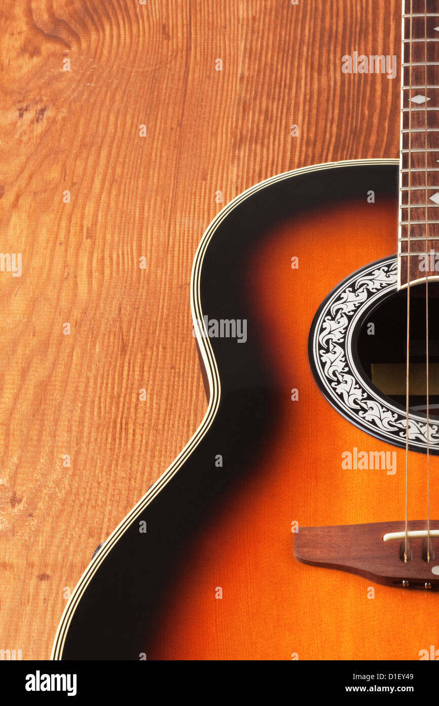 Acoustic guitar against an old barn background Stock Photo - Alamy
