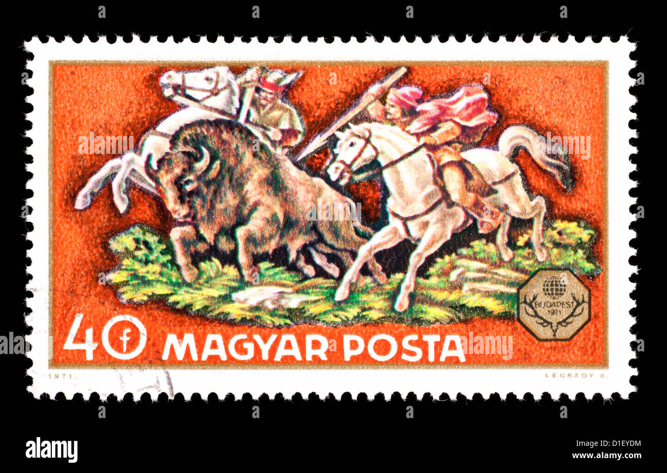 Postage stamp from Hungary depicting a hunter chasing a European bison ...