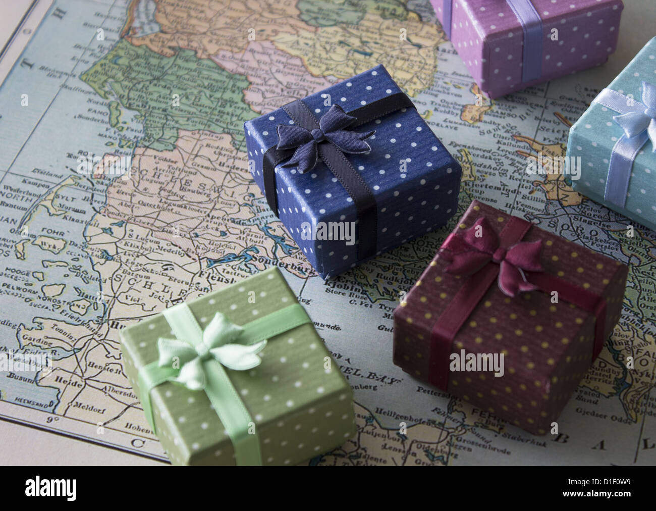 Gift boxes on a map Stock Photo - Alamy