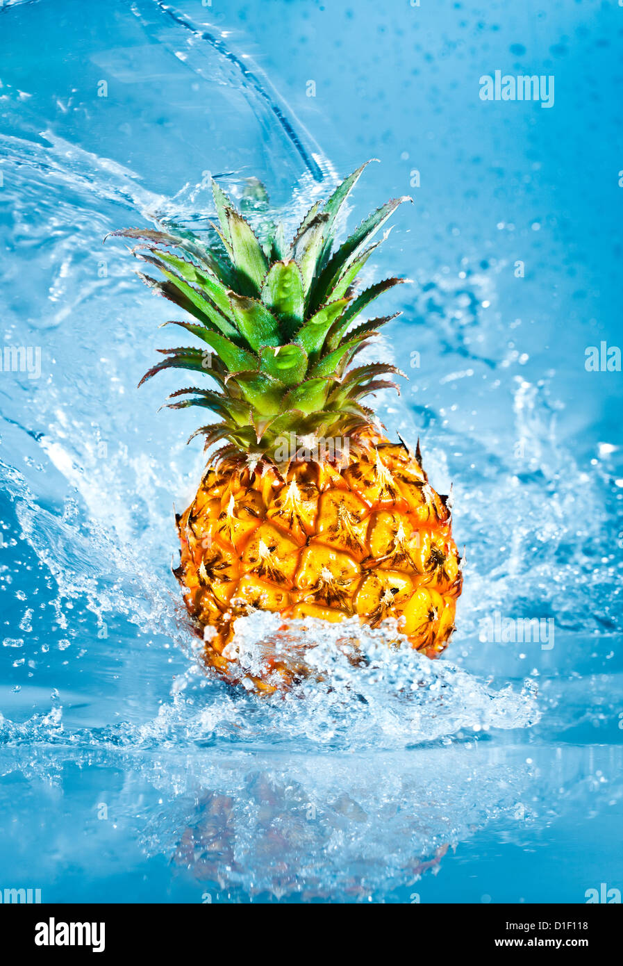 Fresh pineapple in water splashes Stock Photo - Alamy