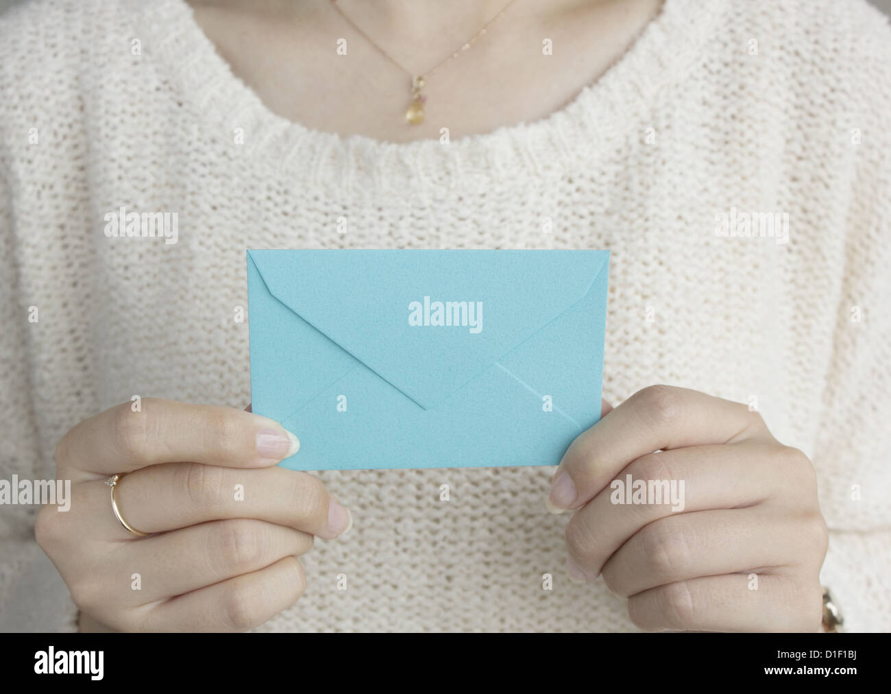 Hands holding an envelope Stock Photo - Alamy