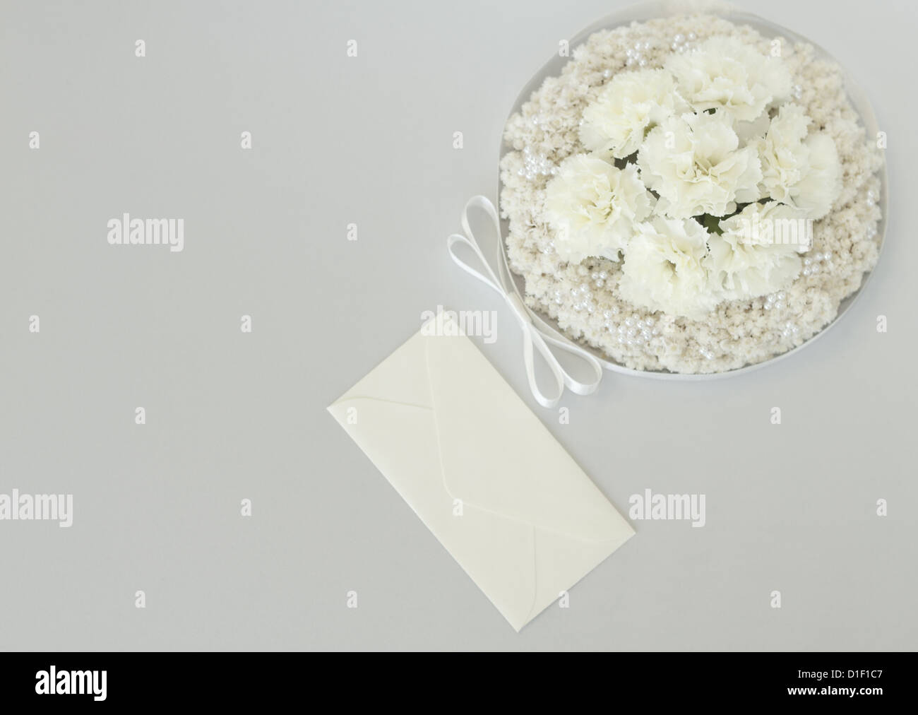 White flower wreath and an envelope Stock Photo - Alamy