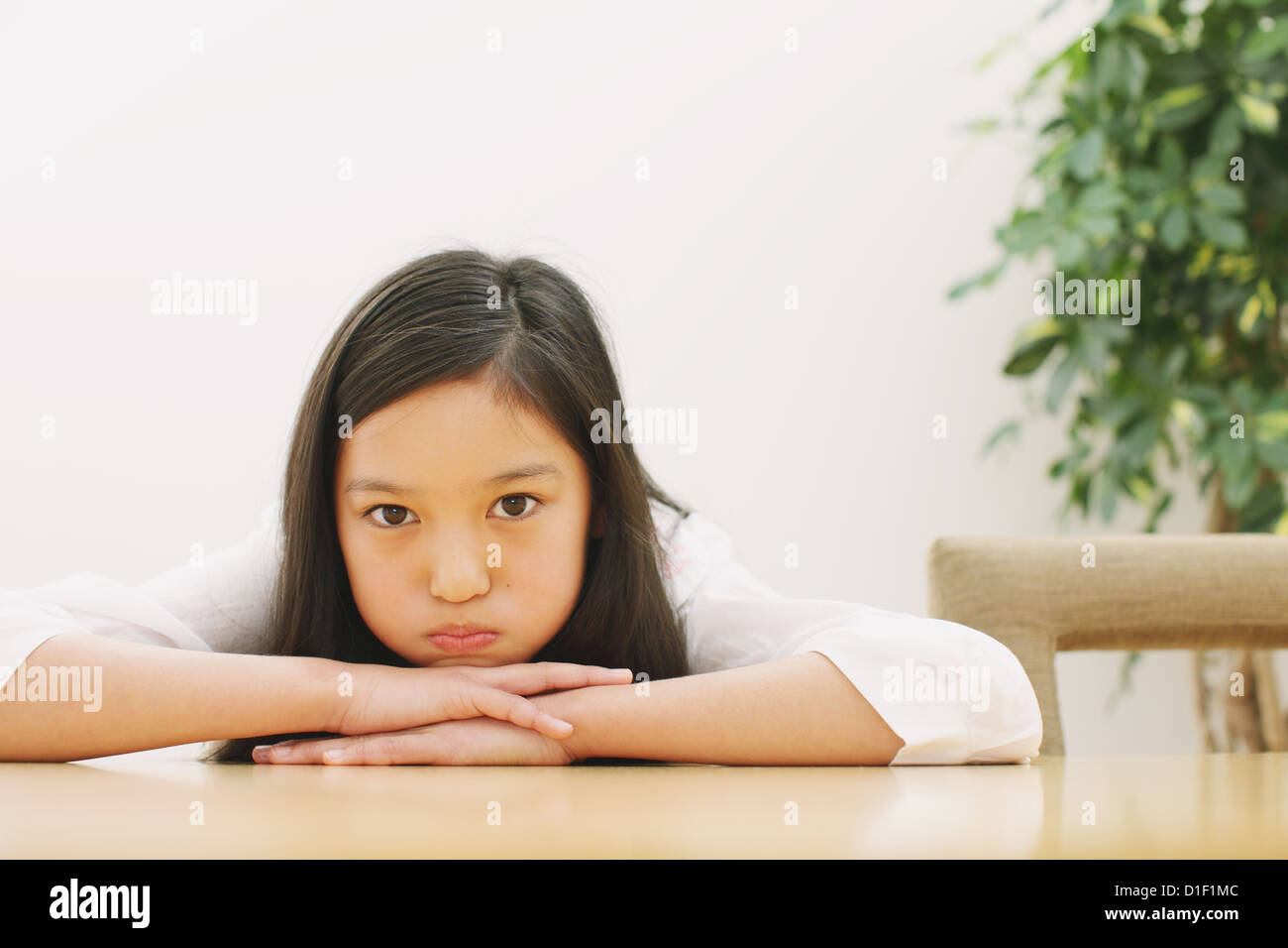 Girl in pre-adolescent age looking at camera with an upset look Stock ...