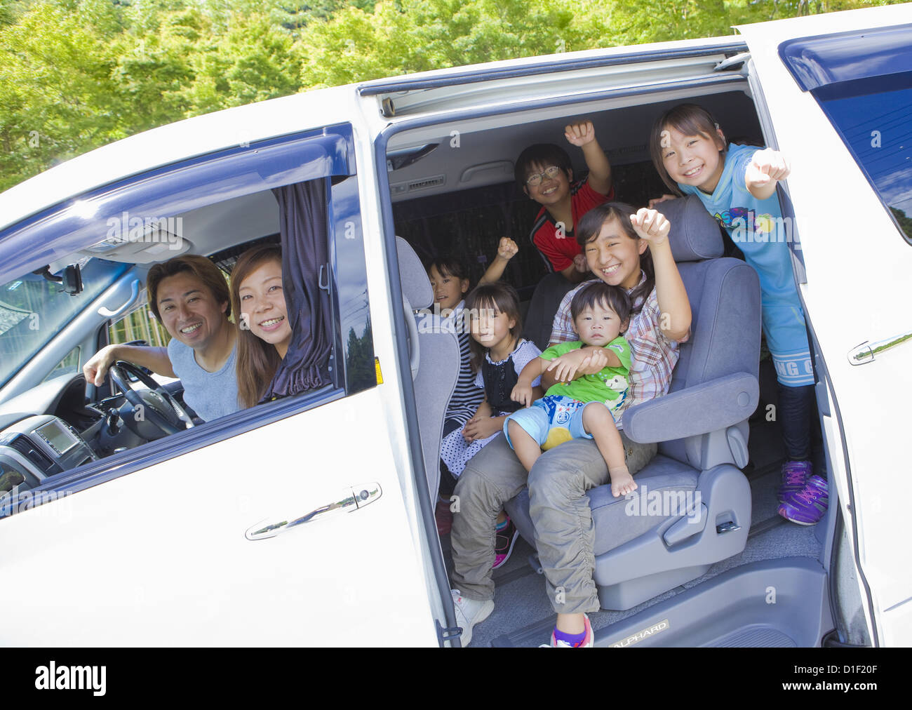 Big family in a car Stock Photo - Alamy