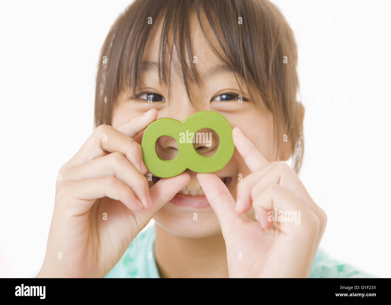 Girl holding a number block Stock Photo - Alamy