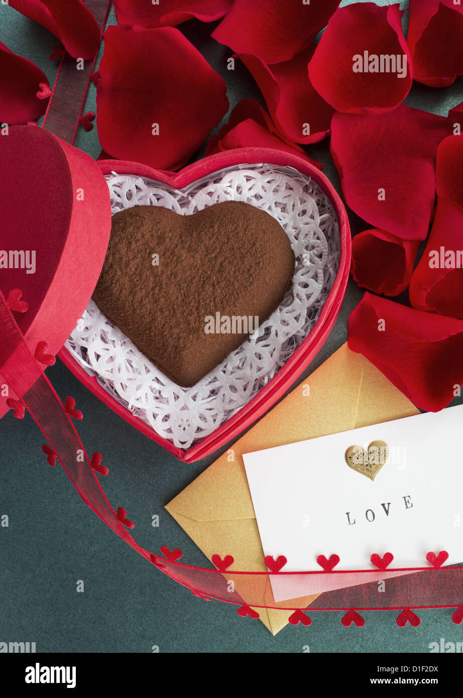 Heart-shaped chocolate and a love letter Stock Photo - Alamy