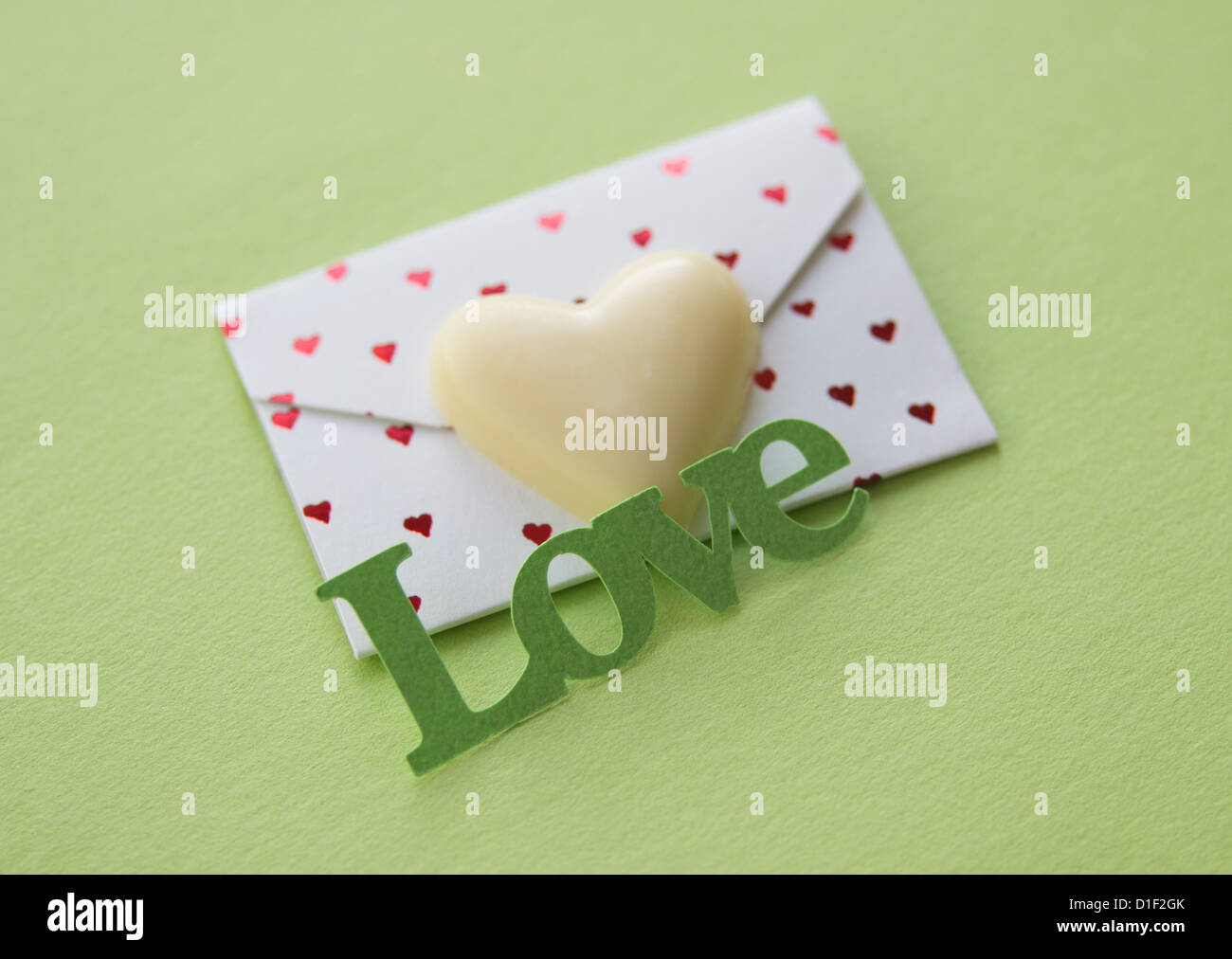 Heart-shaped chocolate and a love letter Stock Photo - Alamy