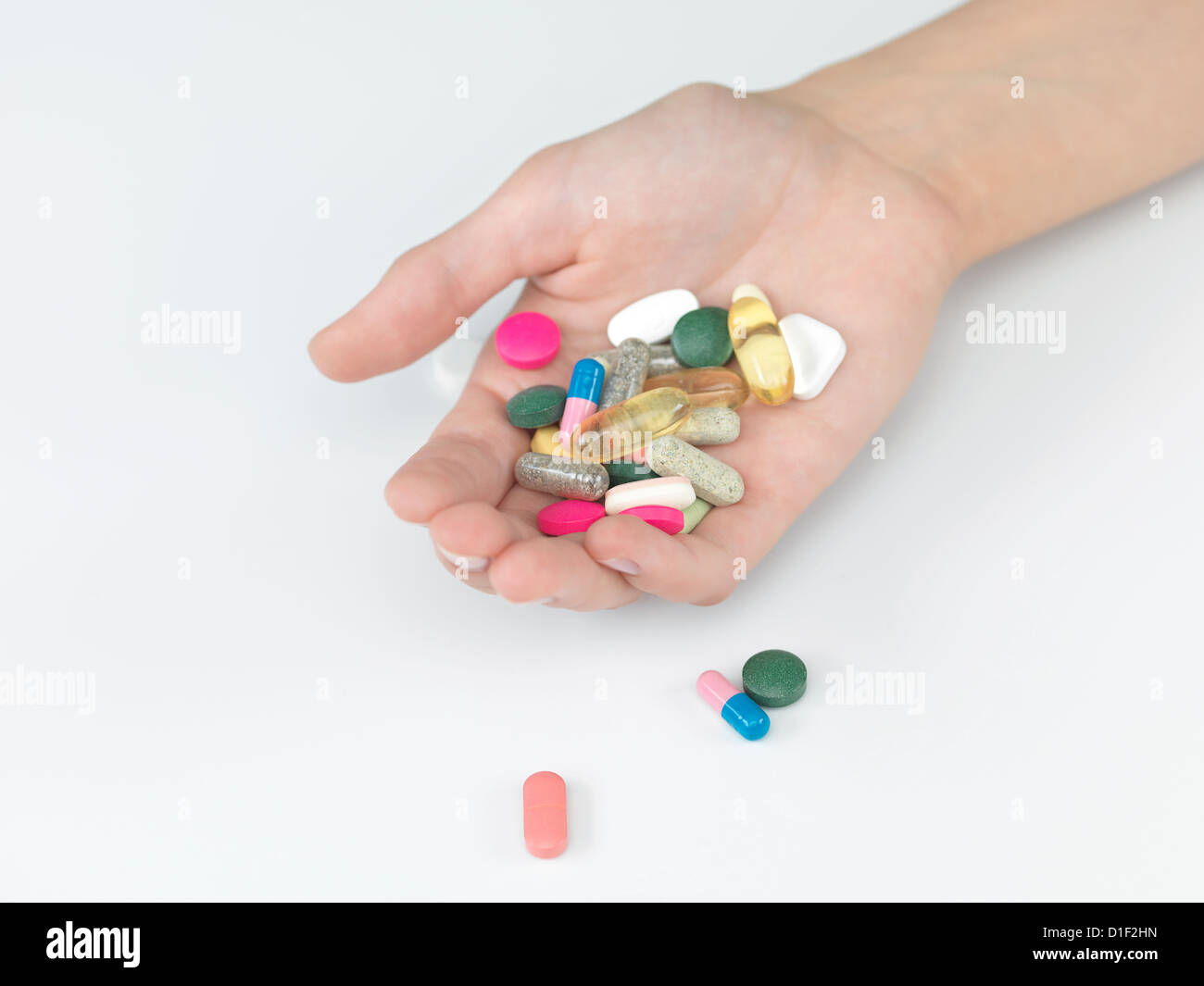 handful of pills with white background Stock Photo - Alamy