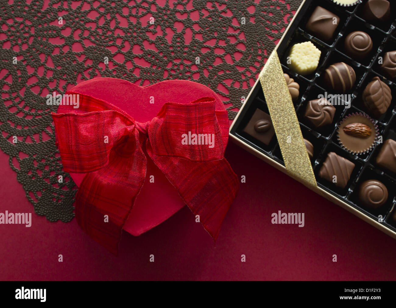 Heart-shaped gift box and assorted chocolates Stock Photo - Alamy