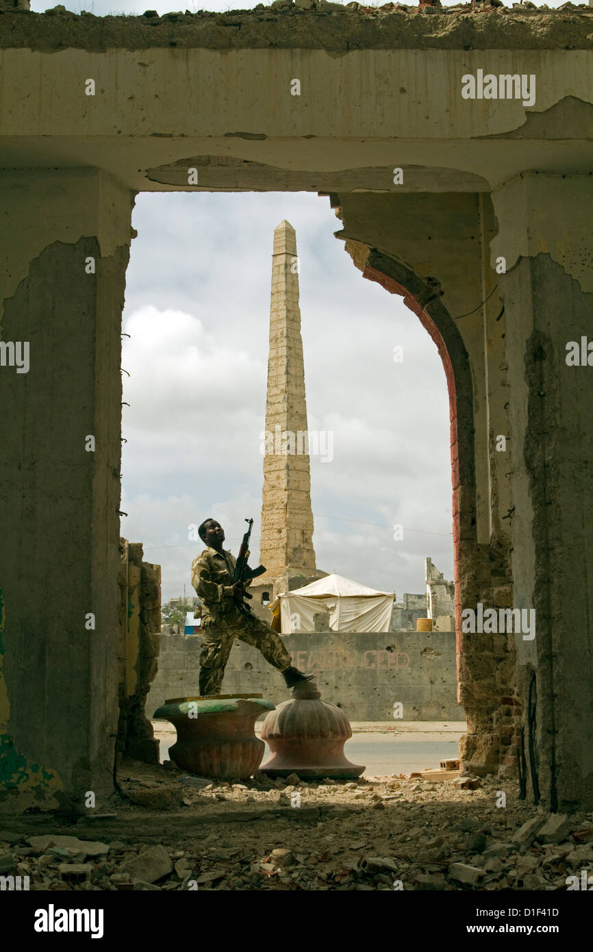 Government soldier securing refugee shelter area Mogadishu Somalia ...