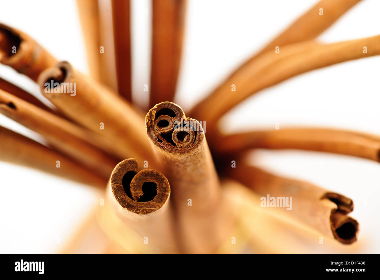 Cinammon sticks on white background Stock Photo - Alamy