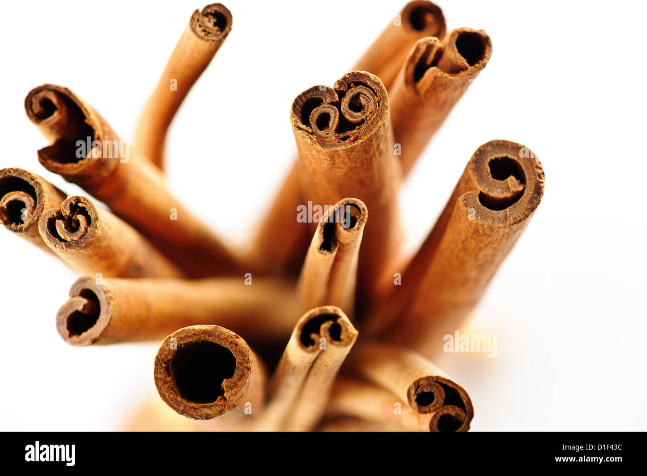Cinammon sticks on white background Stock Photo - Alamy
