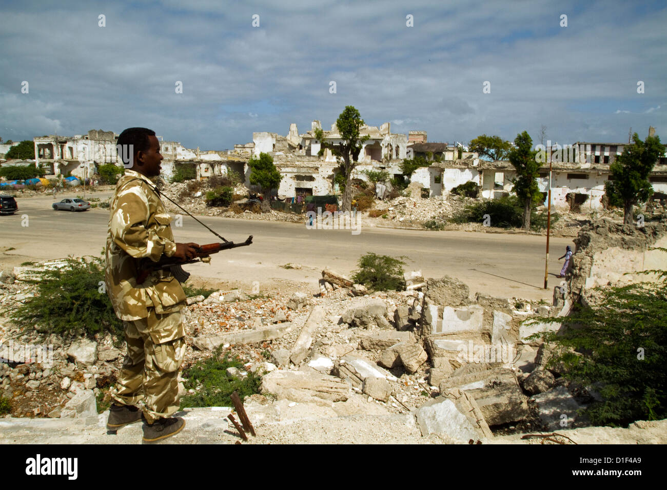 Government soldier securing refugee shelter area Mogadishu Somalia ...