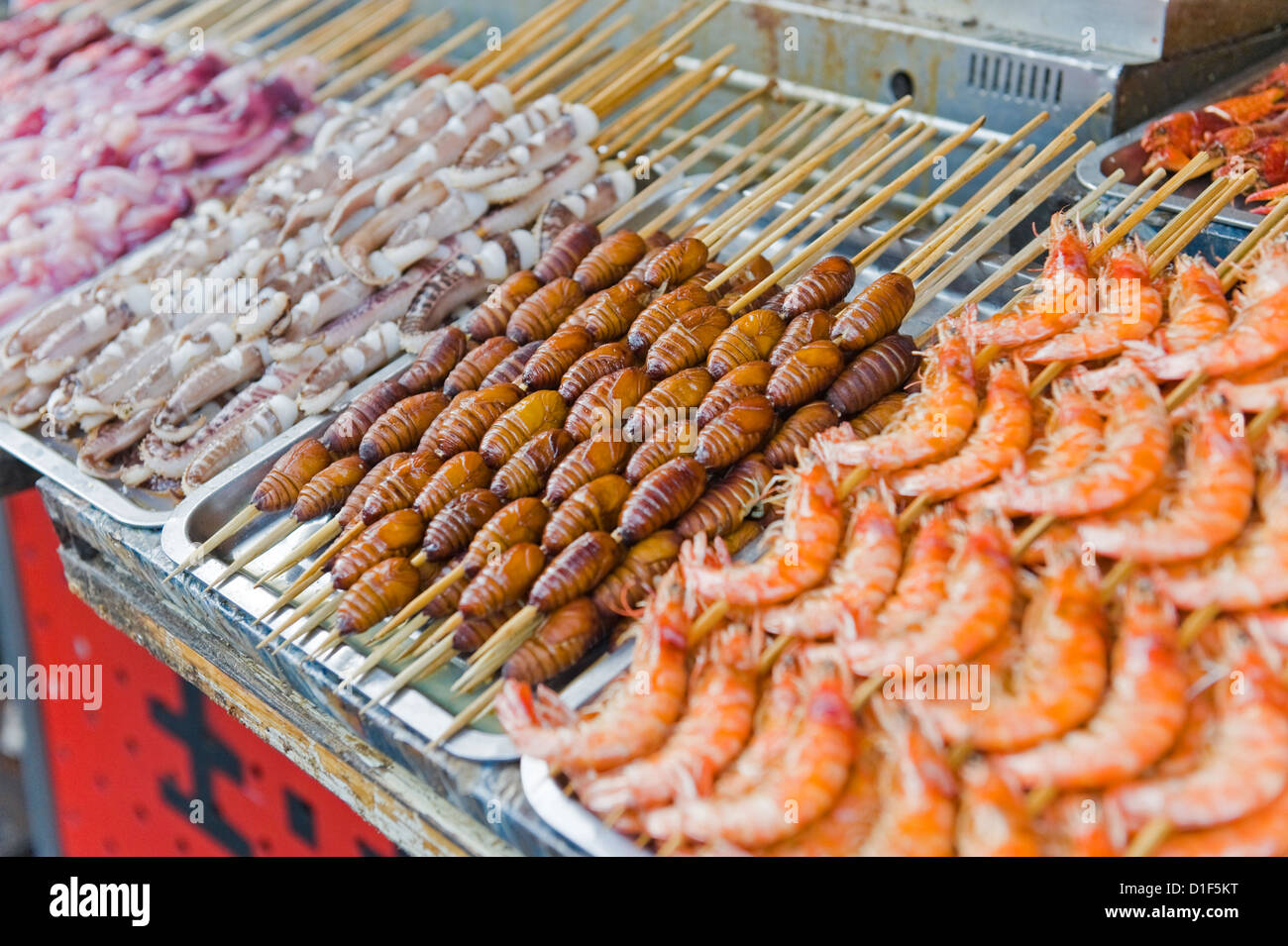Grubs to eat at market Stock Photo - Alamy