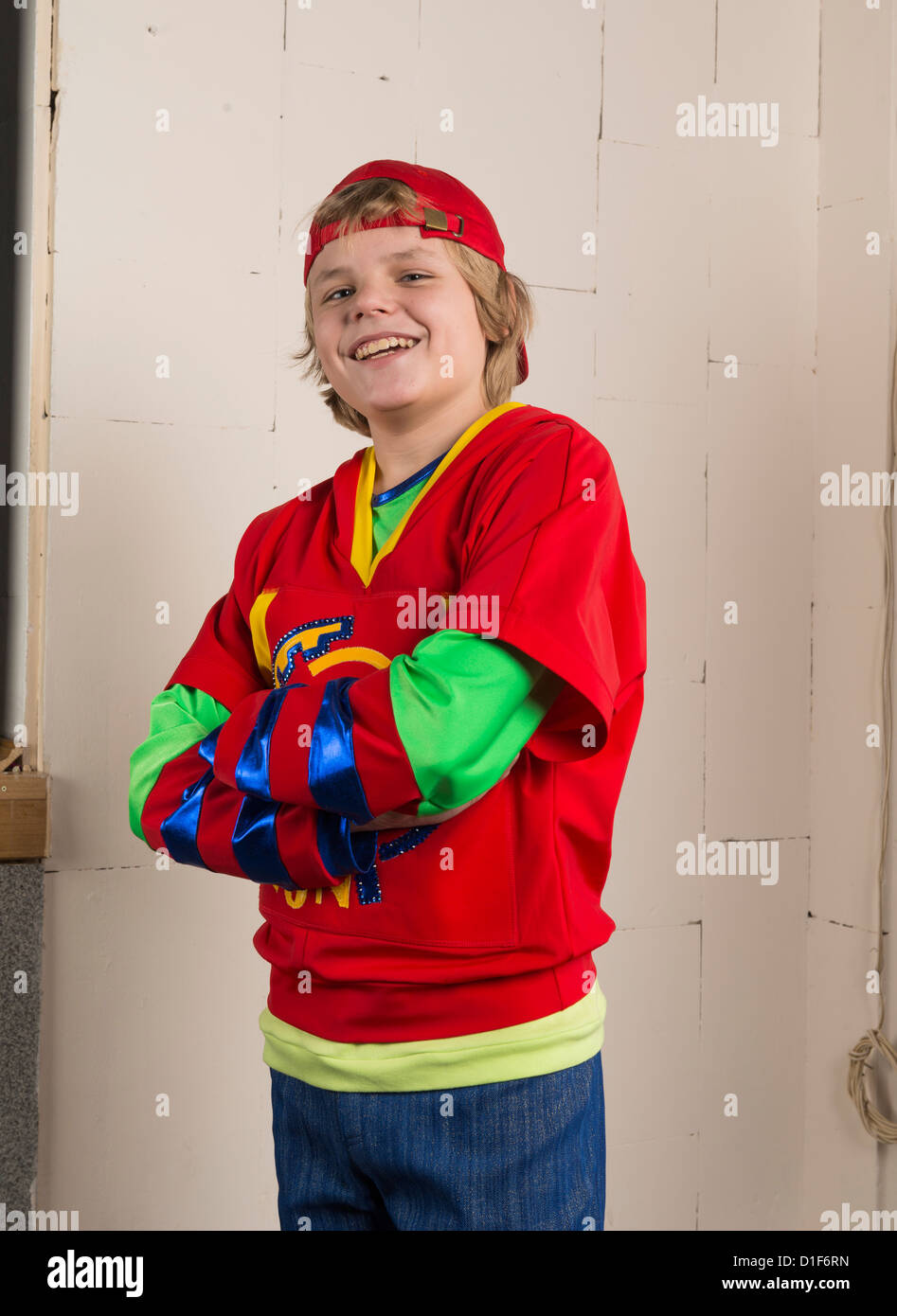 Cheerful boy posing wearing bright red clothes Stock Photo - Alamy