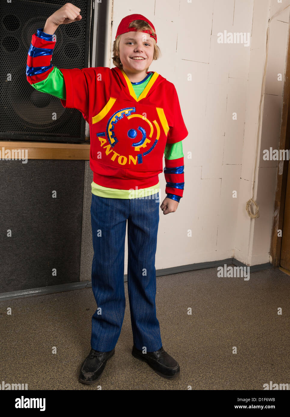 Cheerful boy posing wearing bright red clothes Stock Photo - Alamy
