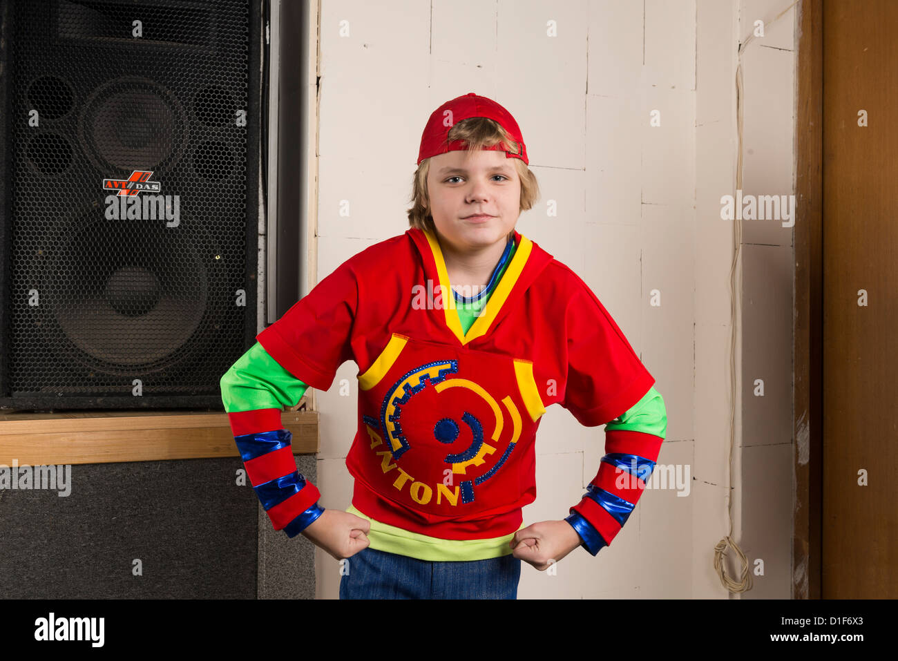Cheerful boy posing wearing bright red clothes Stock Photo - Alamy