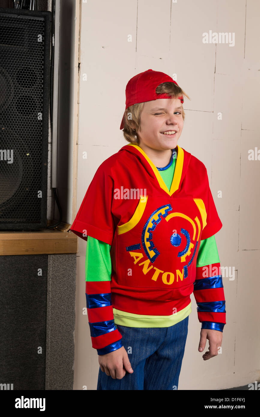 Cheerful boy posing wearing bright red clothes Stock Photo - Alamy
