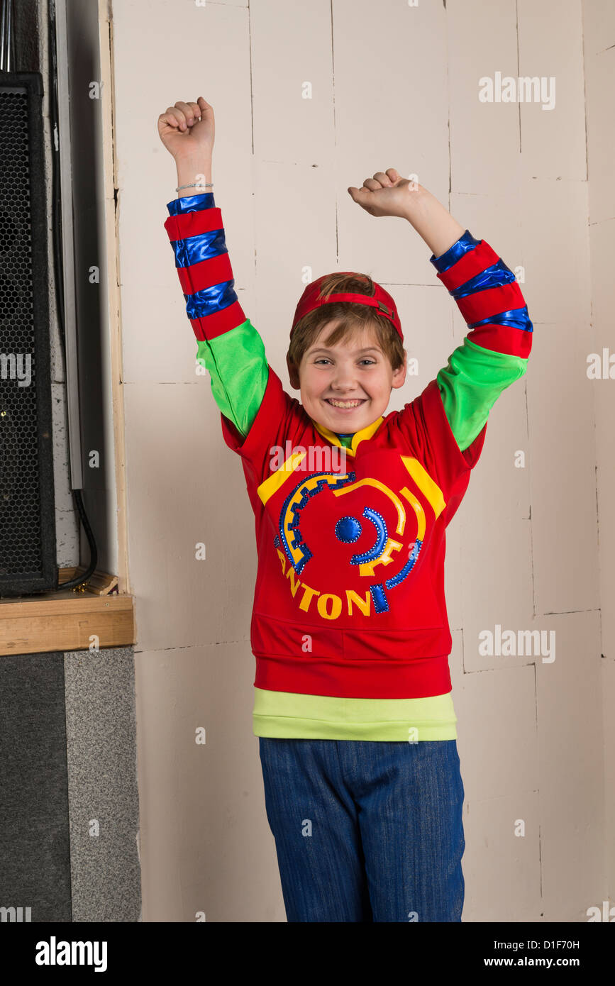 Cheerful boy posing wearing bright red clothes Stock Photo - Alamy