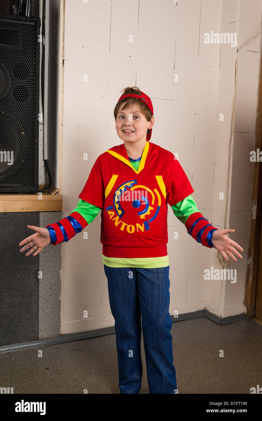 Cheerful boy posing wearing bright red clothes Stock Photo - Alamy