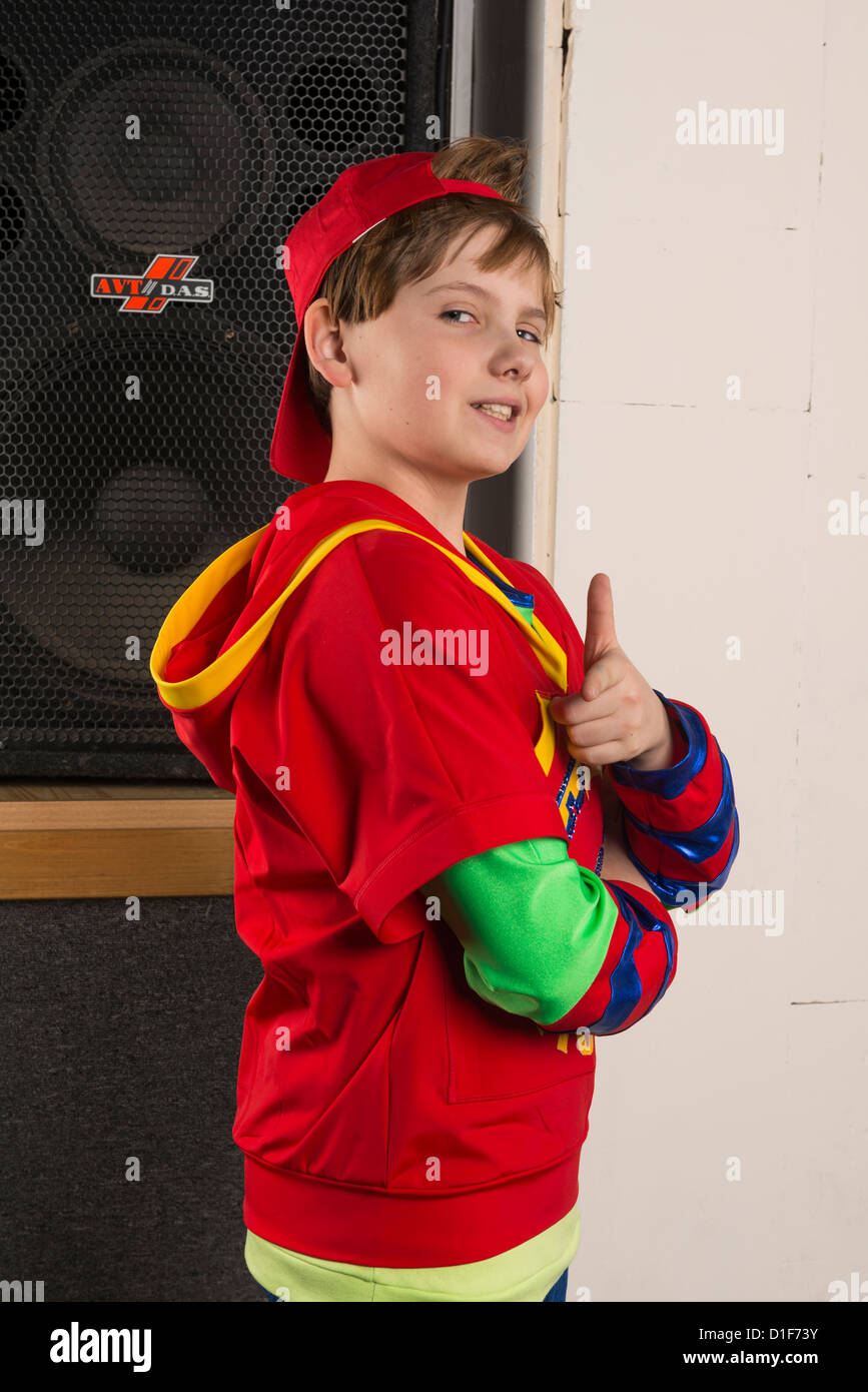 Cheerful boy posing wearing bright red clothes Stock Photo - Alamy