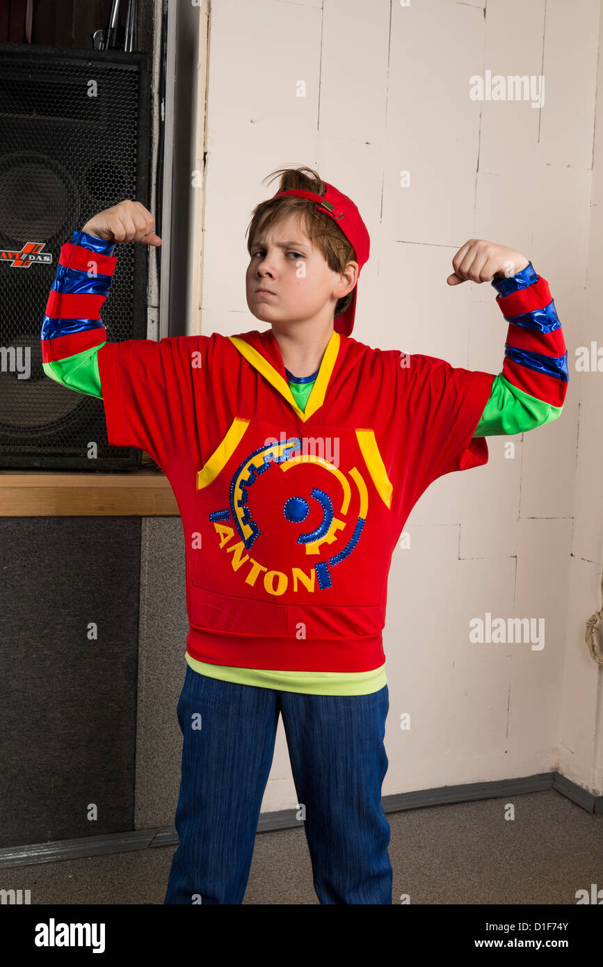 Cheerful boy posing wearing bright red clothes Stock Photo - Alamy
