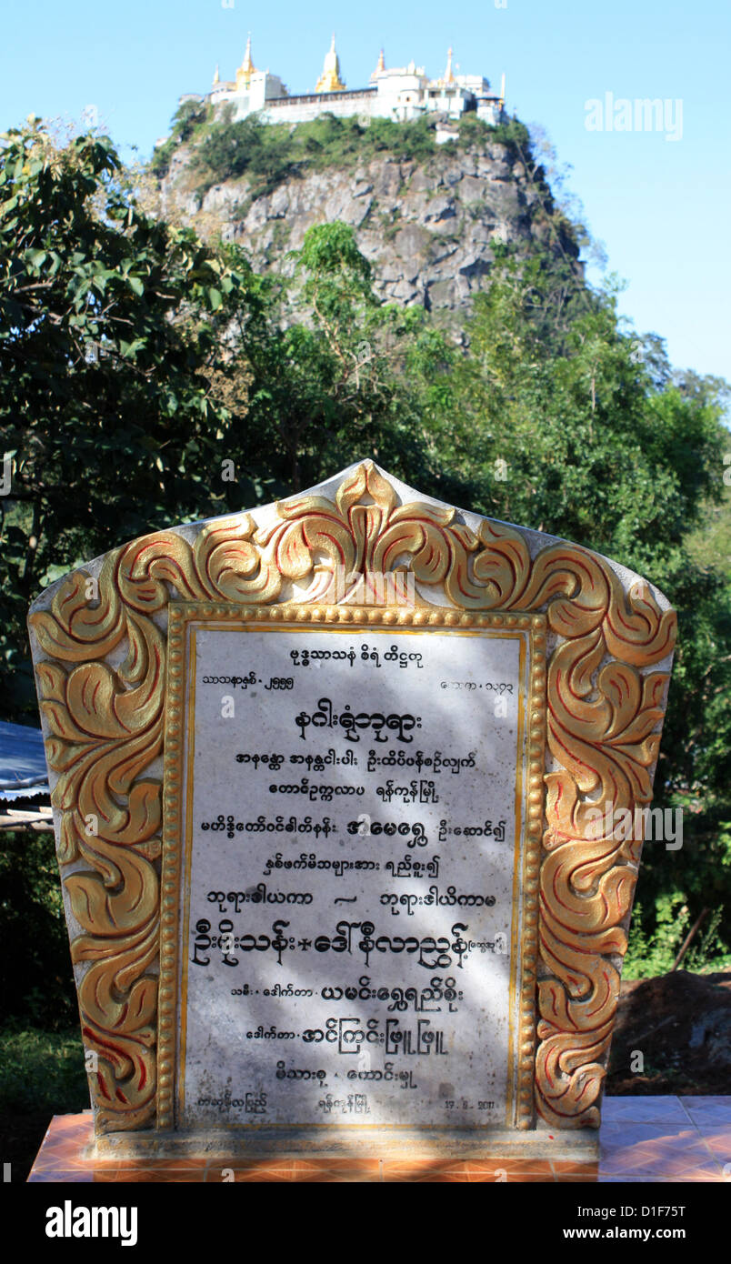 A plaque is seen below the Mount Popa in the Kyaukpadaung Township ...