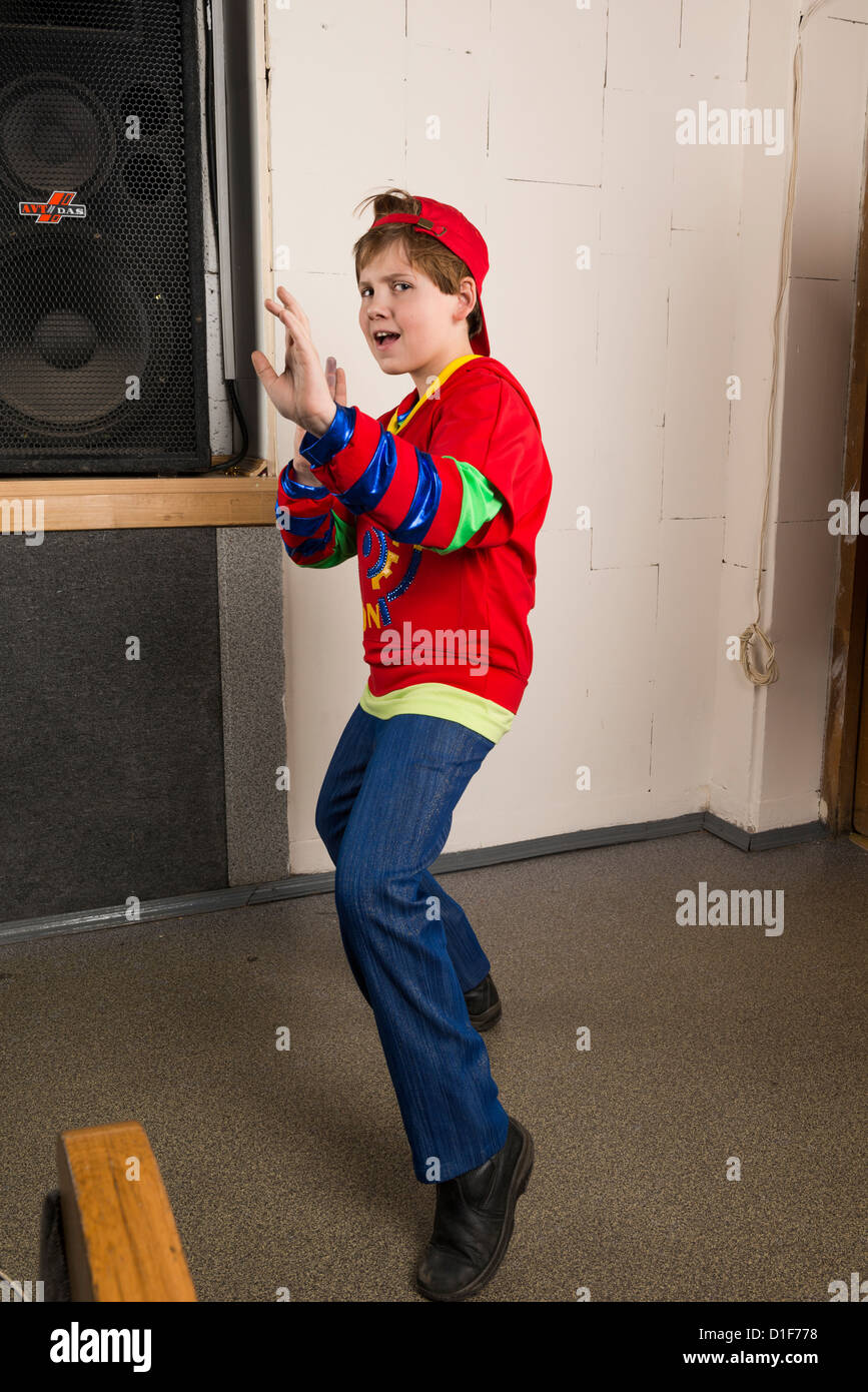 Cheerful boy posing wearing bright red clothes Stock Photo - Alamy