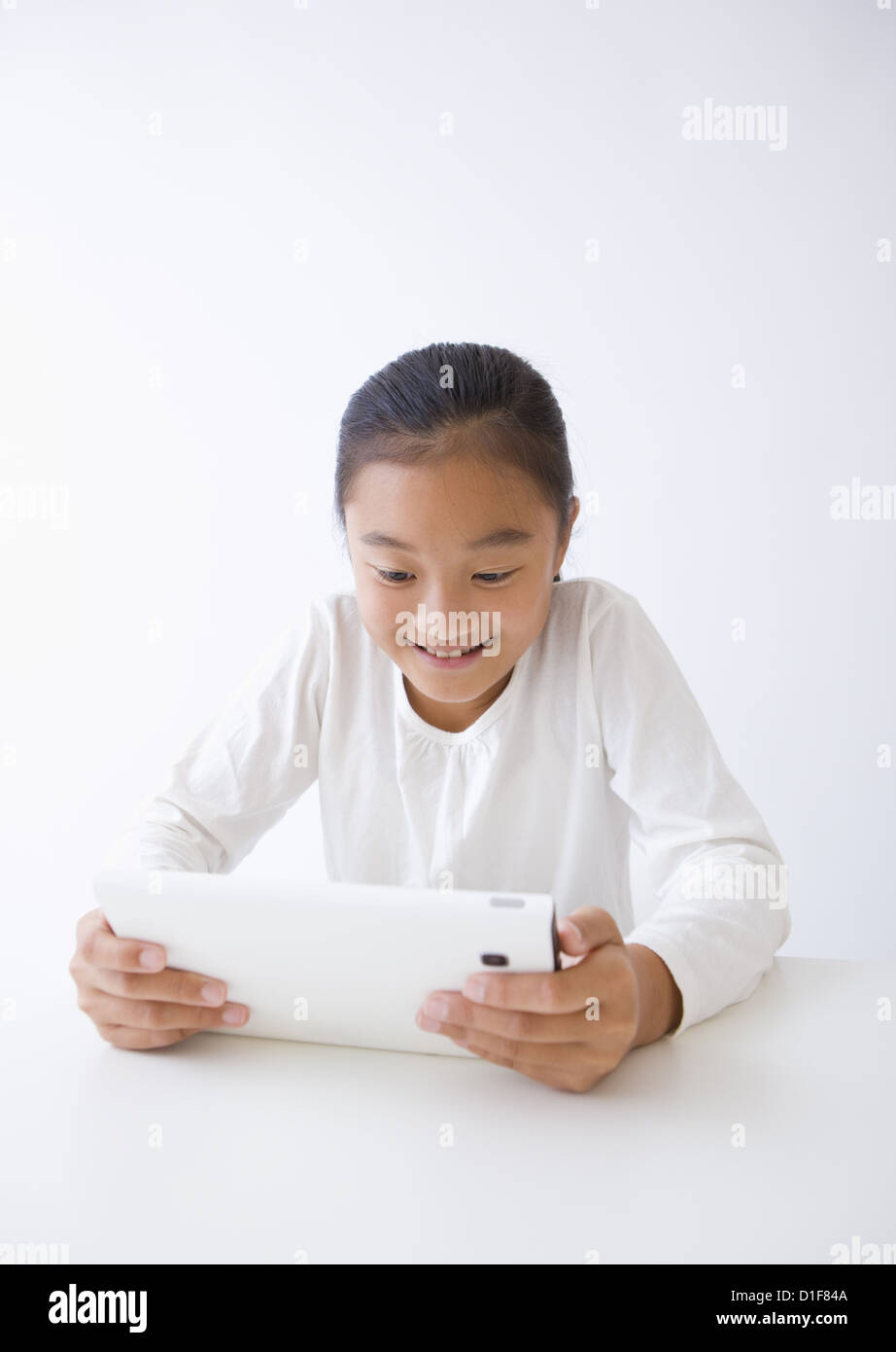 Girl using a tablet PC Stock Photo - Alamy