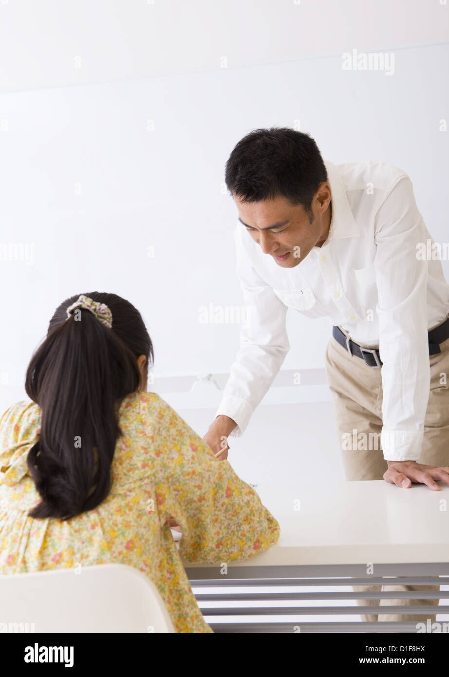 Private tutoring school teacher and a student Stock Photo - Alamy