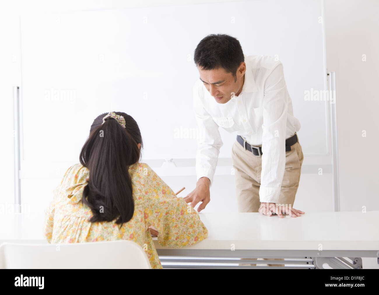 Private teacher teaching a black hi-res stock photography and images ...