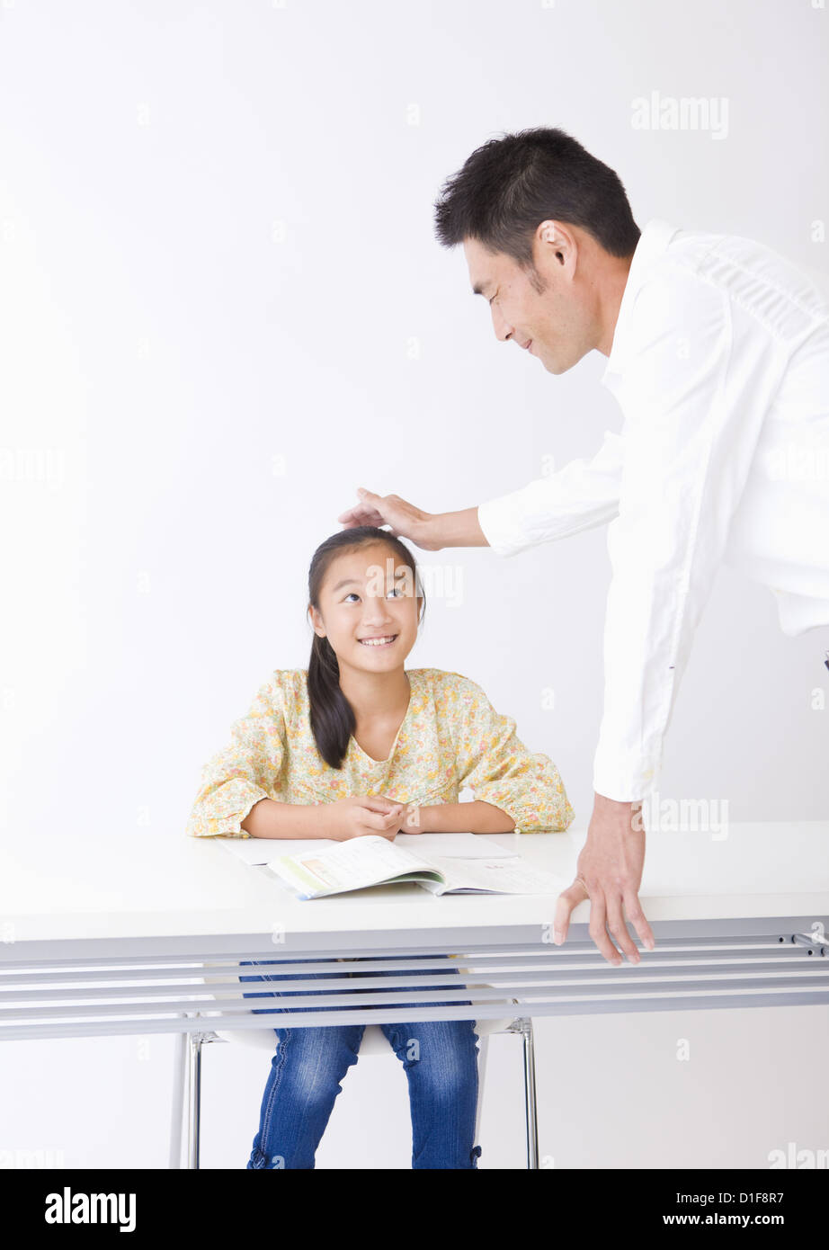 Patting a head hi-res stock photography and images - Alamy