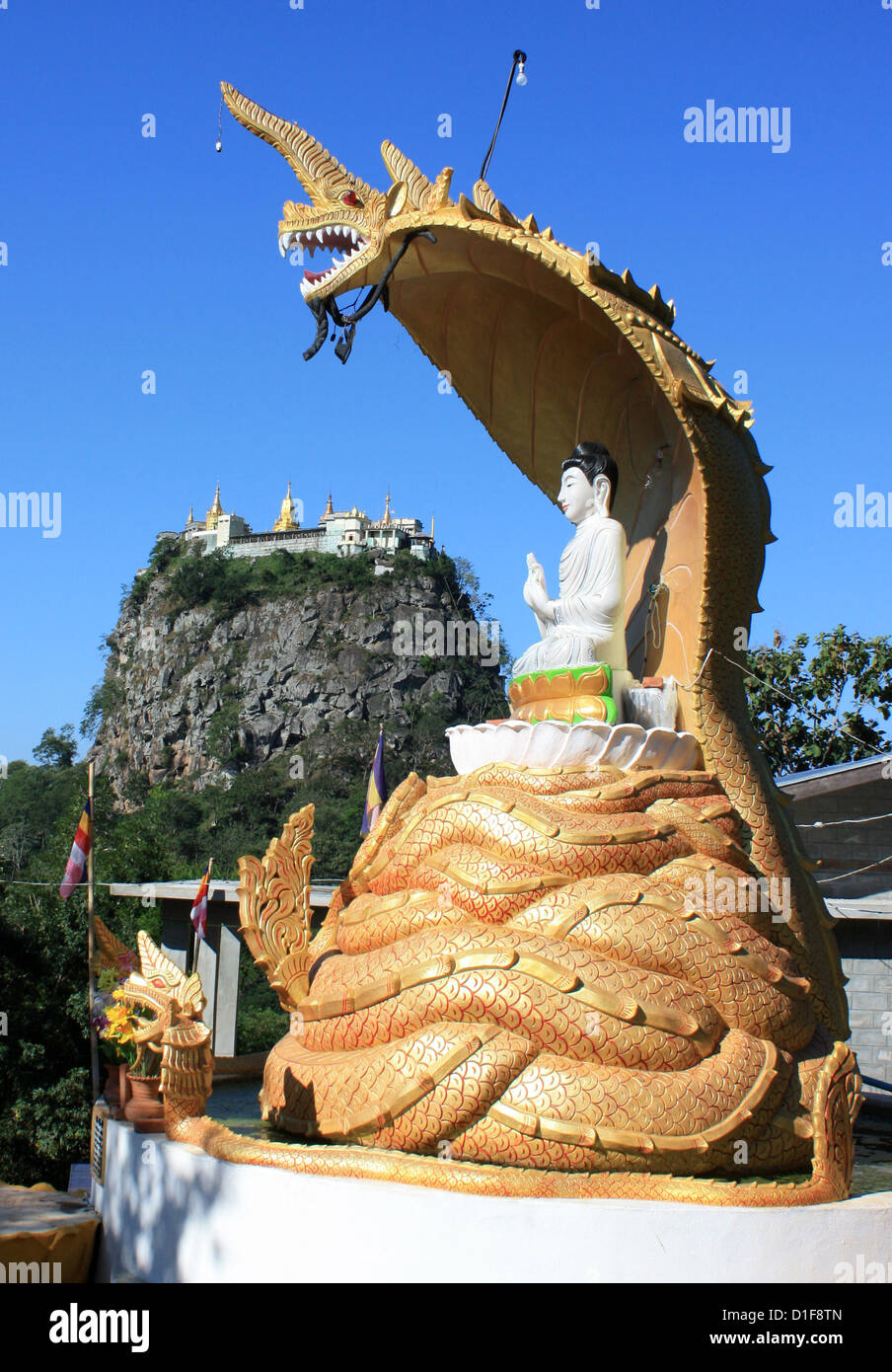 Buildings are seen below the Mount Popa in the Kyaukpadaung Township ...
